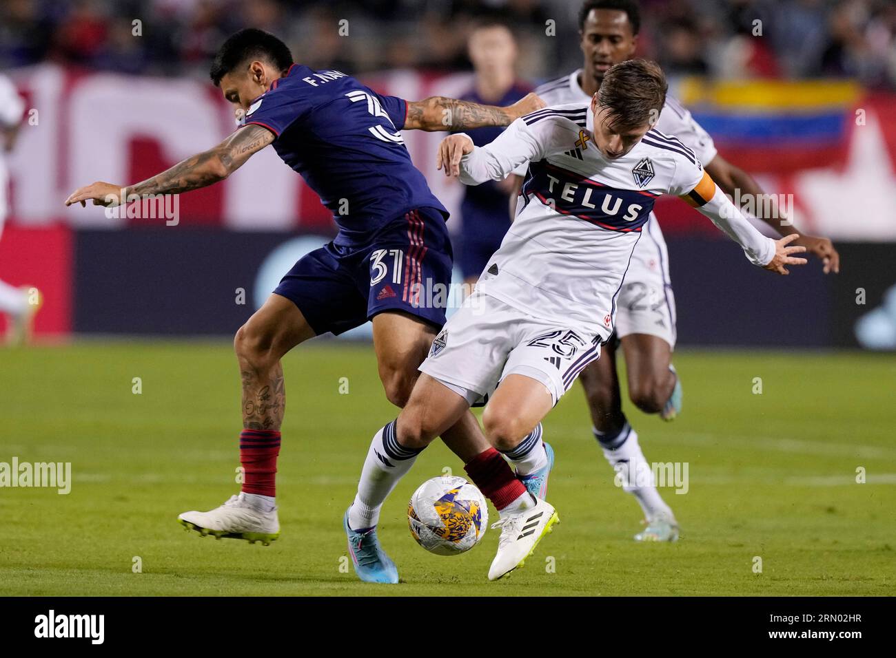 Chicago Fire midfielder Federico Navarro, left, and Vancouver Whitecaps midfielder Ryan Gauld ...