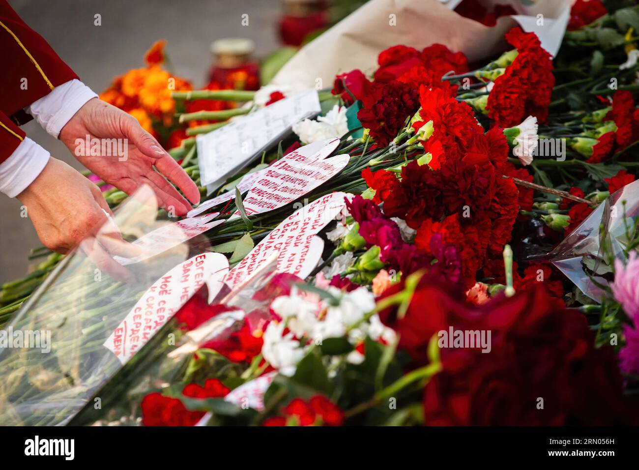 A woman came to lay flowers in memory of the head of the Wagner Group ...