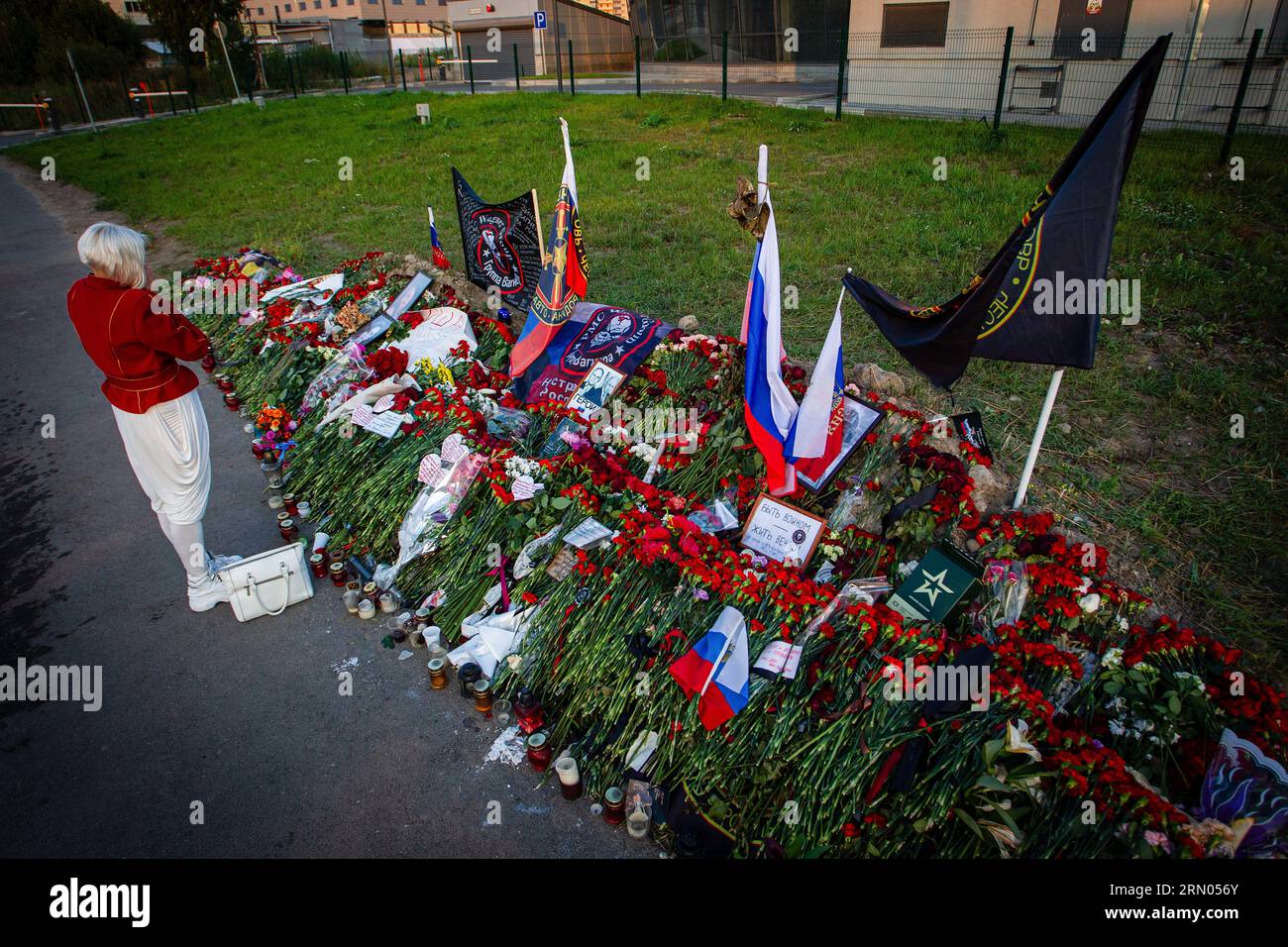 A woman came to lay flowers in memory of the head of the Wagner Group, Yevgeny Prigozhin, at a ...