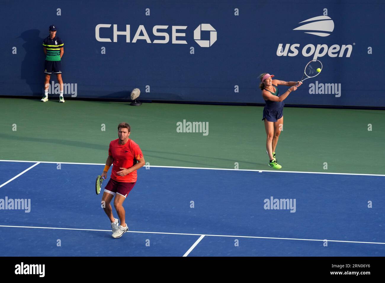 Danielle Collins and Ryan Harrison in action during a mixed doubles ...