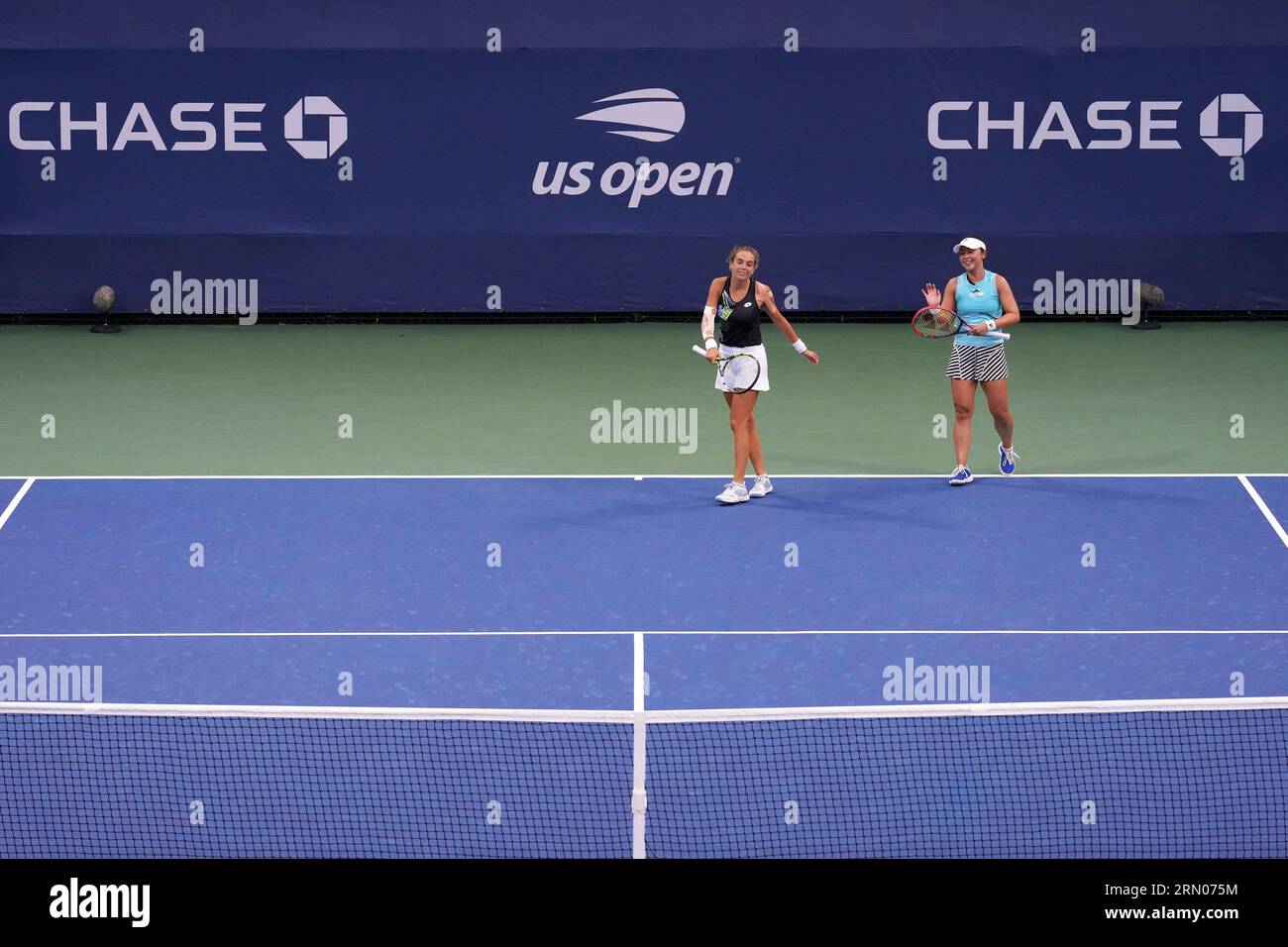 Lucia Bronzetti and Eri Hozumi react during a women's doubles match at ...