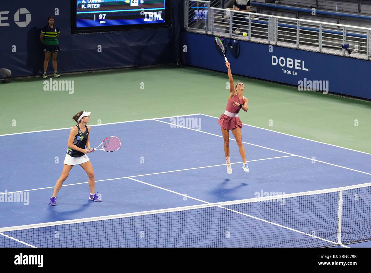 Katarzyna Piter and Alizé Cornet in action during a women's doubles ...