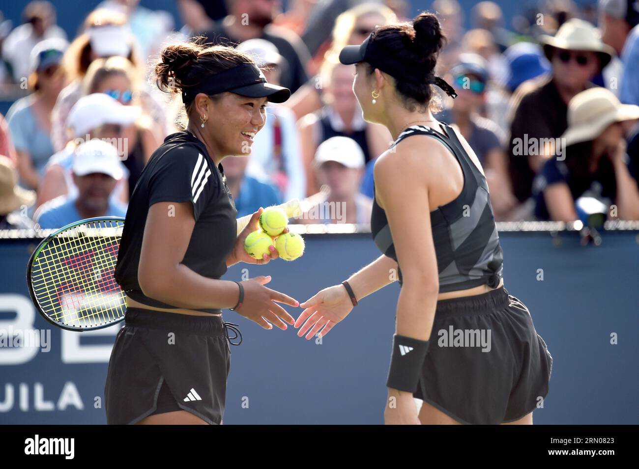 Olivia Center and Kate Fakih in action during a women's doubles match ...