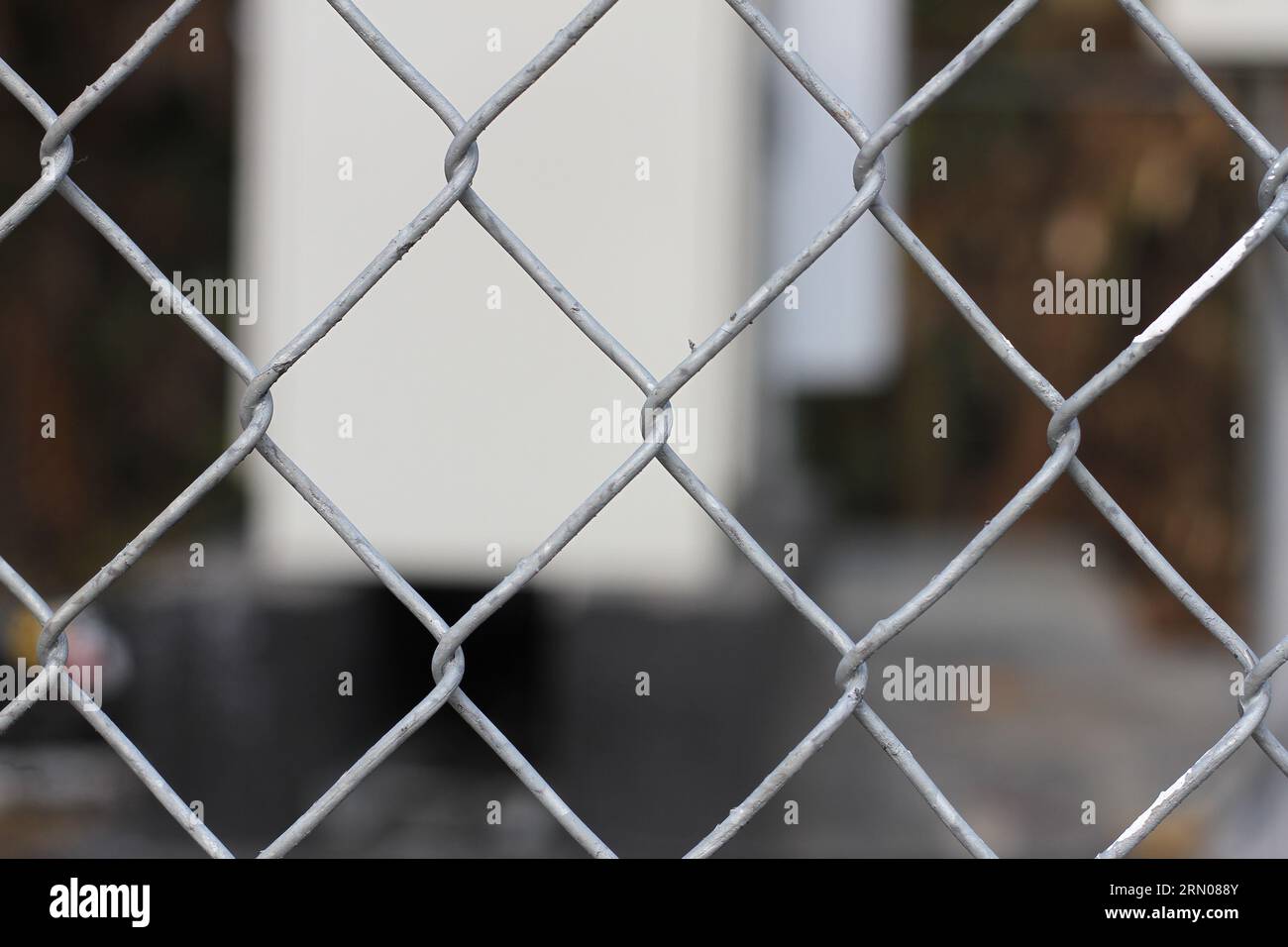 Harmonica wire fence Stock Photo - Alamy