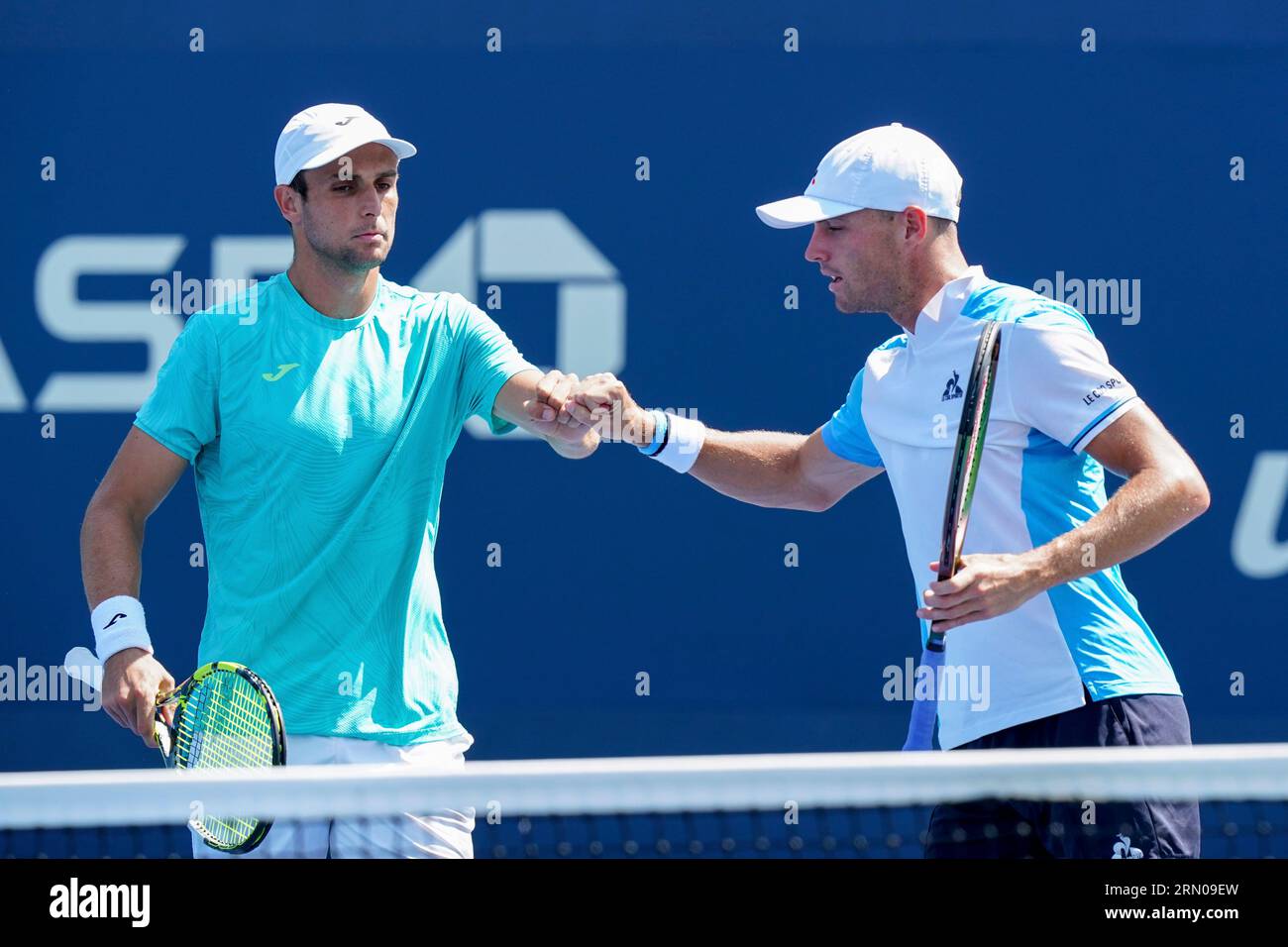 Christopher O'Connell and Aleksandar Vukic fist pump during a men's doubles match at the 2023 US ...