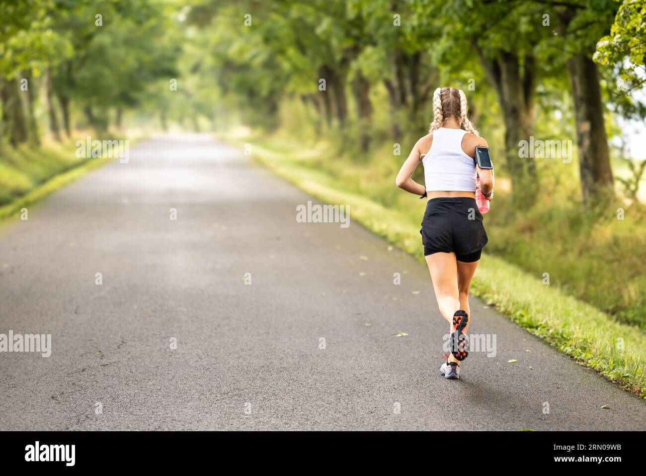 Female runner back hi-res stock photography and images - Alamy