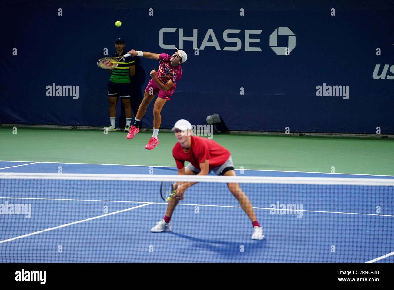 Nicholas Godsick and Ethan Quinn in action during a men's doubles match ...