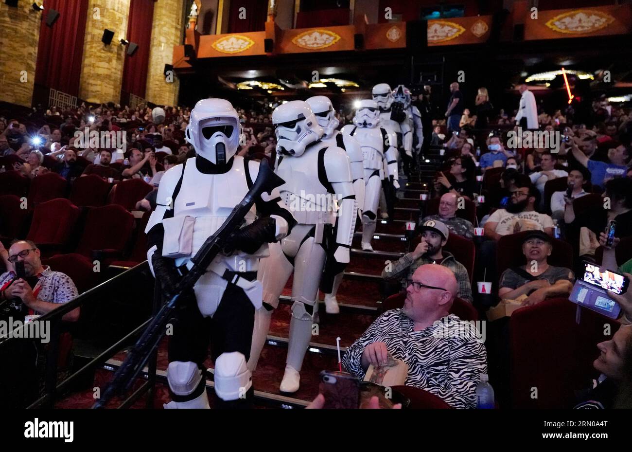 "Star Wars" stormtrooper characters march down the center aisle at the ...