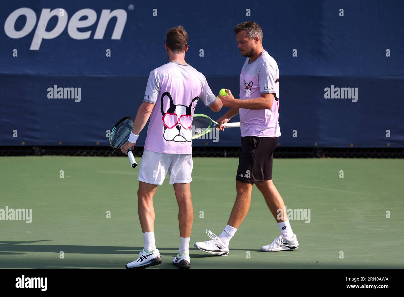 Ariel Behar and Adam Pavlasek in action during a men's doubles match at ...