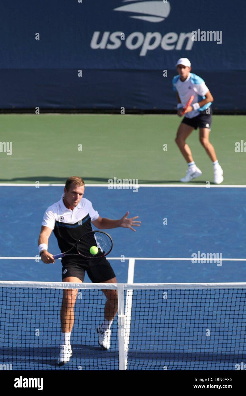 Bart Stevens and Matteo Arnaldi in action during a men's doubles match ...