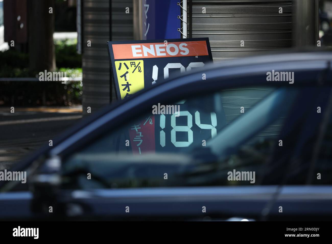 The prices of petrol and diesel are displayed on a signboard at a gas ...