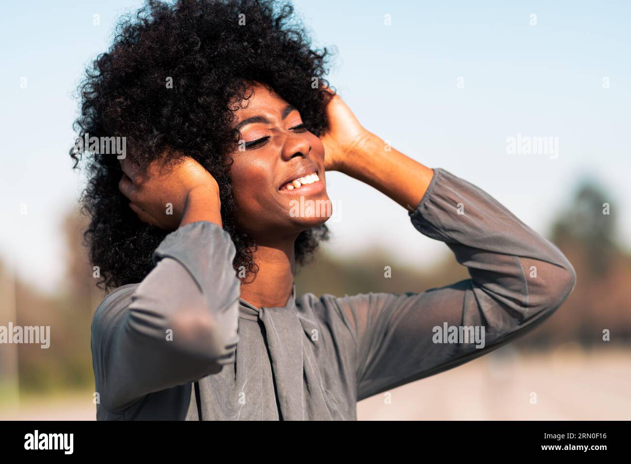 beautiful model of color smiling, dancing with a lot of joy and ...