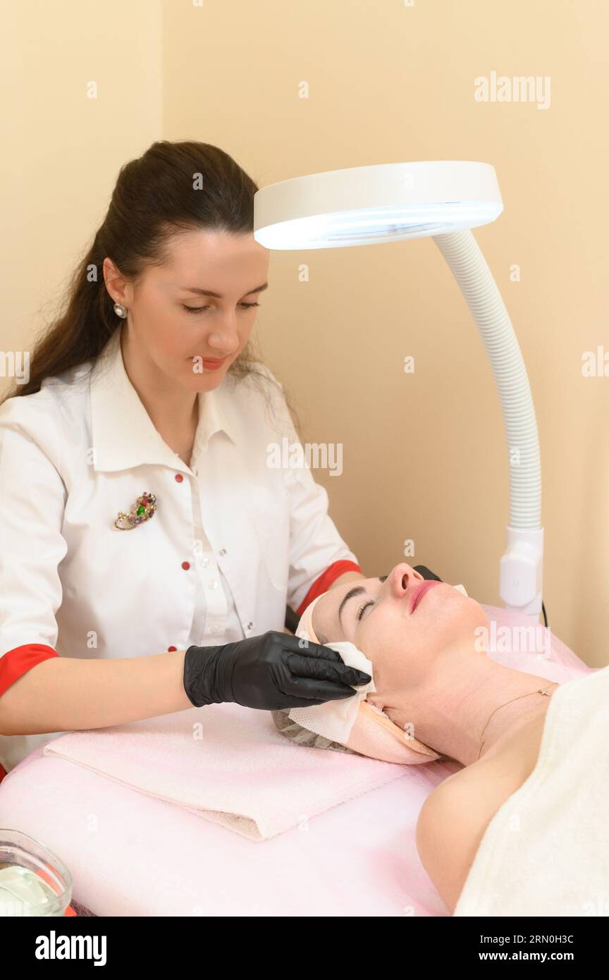 The procedure of washing a girl by a beautician before or after the ...