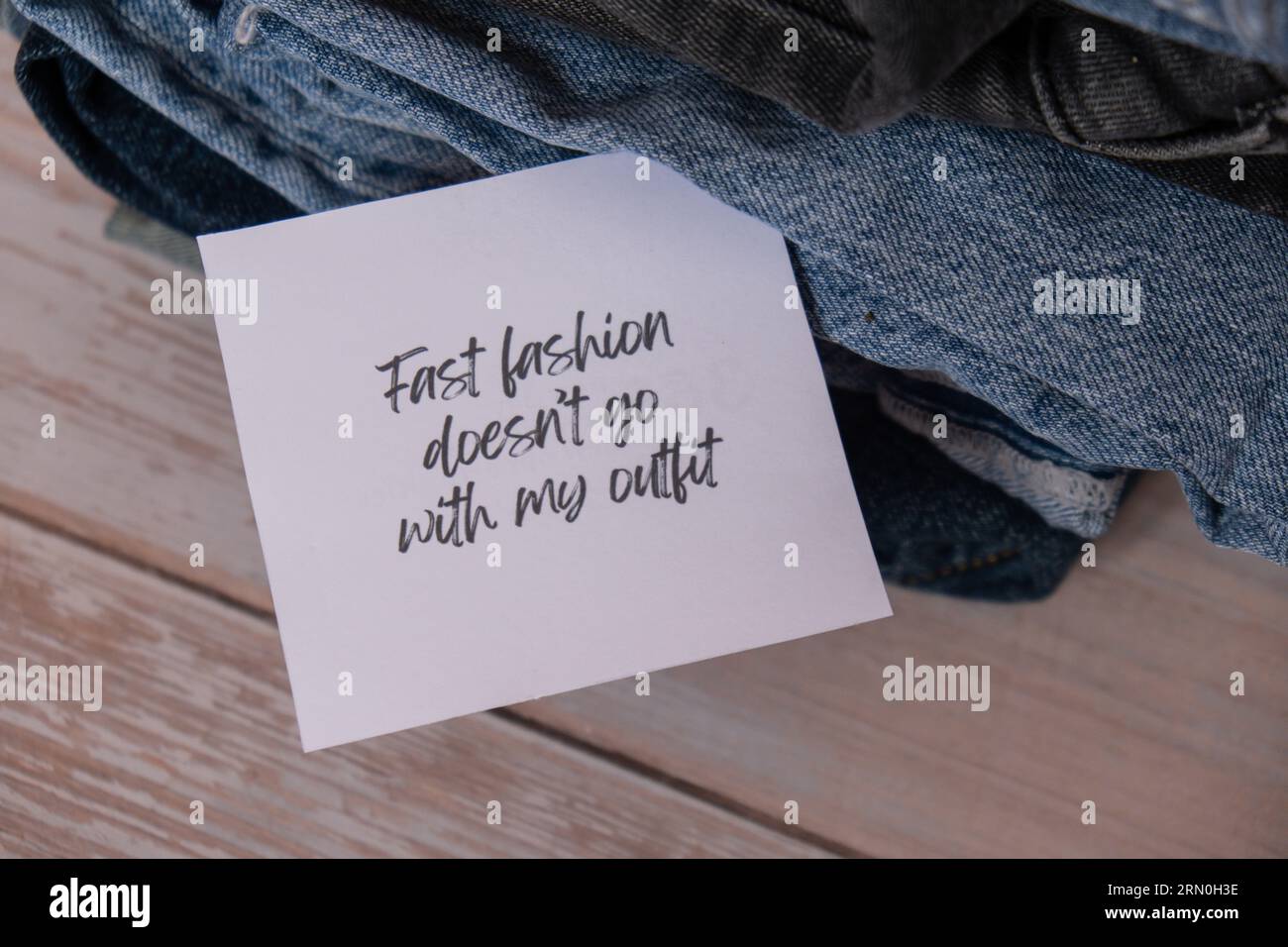 FAST FASHION DOESNT GO WITH MY OUTFIT text on paper note on Jeans ...