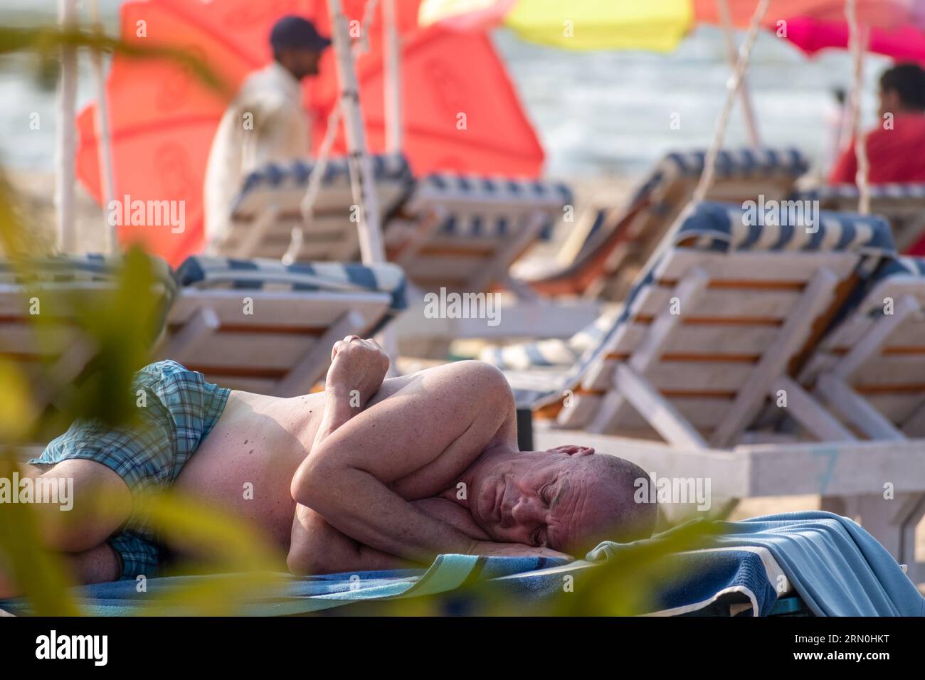 Calangute, Goa, India - January 2023: A Caucasian male tourist sleeping ...