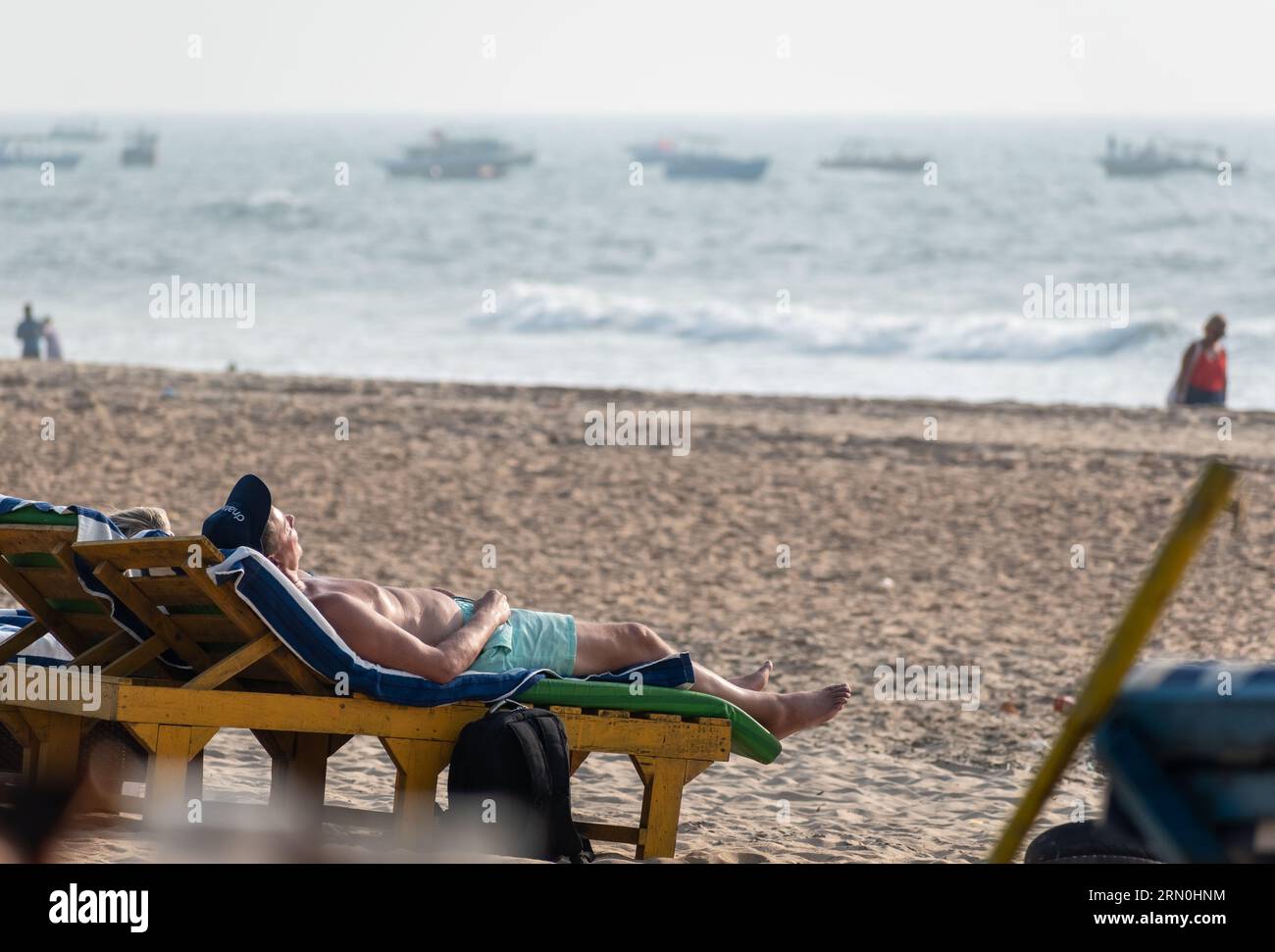 Calangute, Goa, India - January 2023: A Caucasian tourist relaxing on a ...
