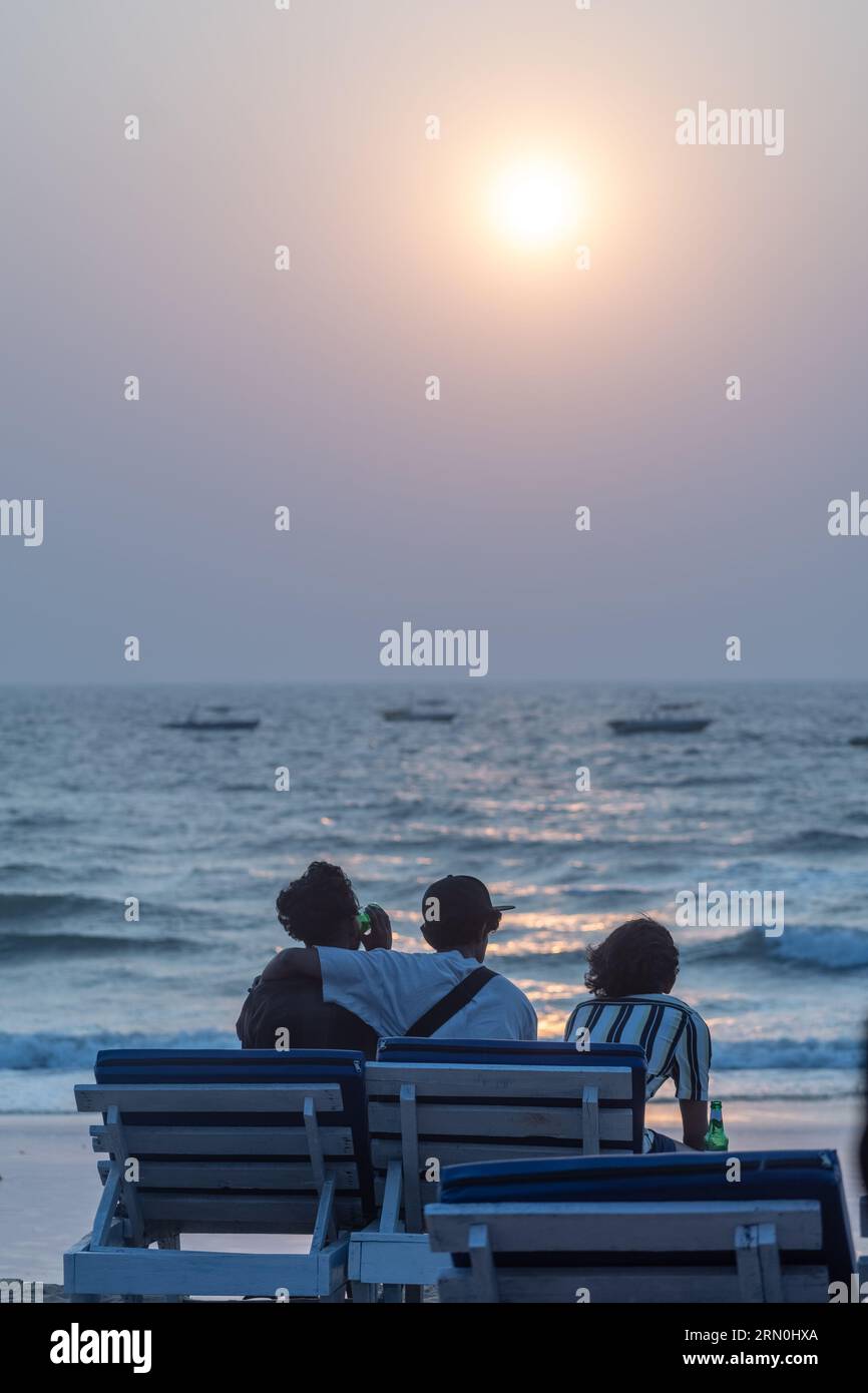 Calangute, Goa, India - January 2023: Backlit vertical shot of three ...
