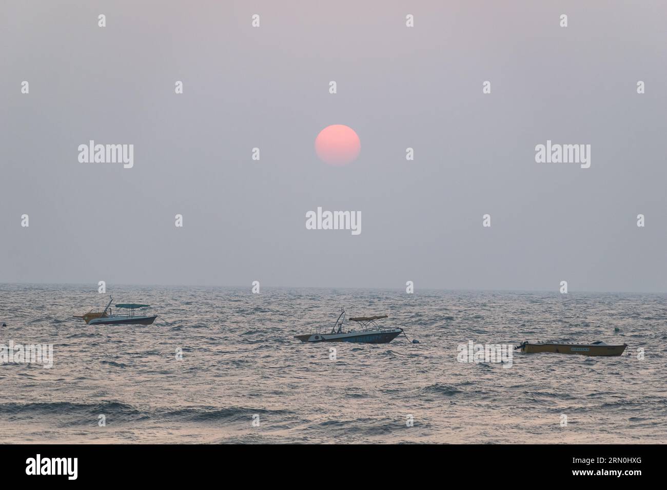 Calangute, Goa, India - January 2023: Sun set above boats sailing in ...