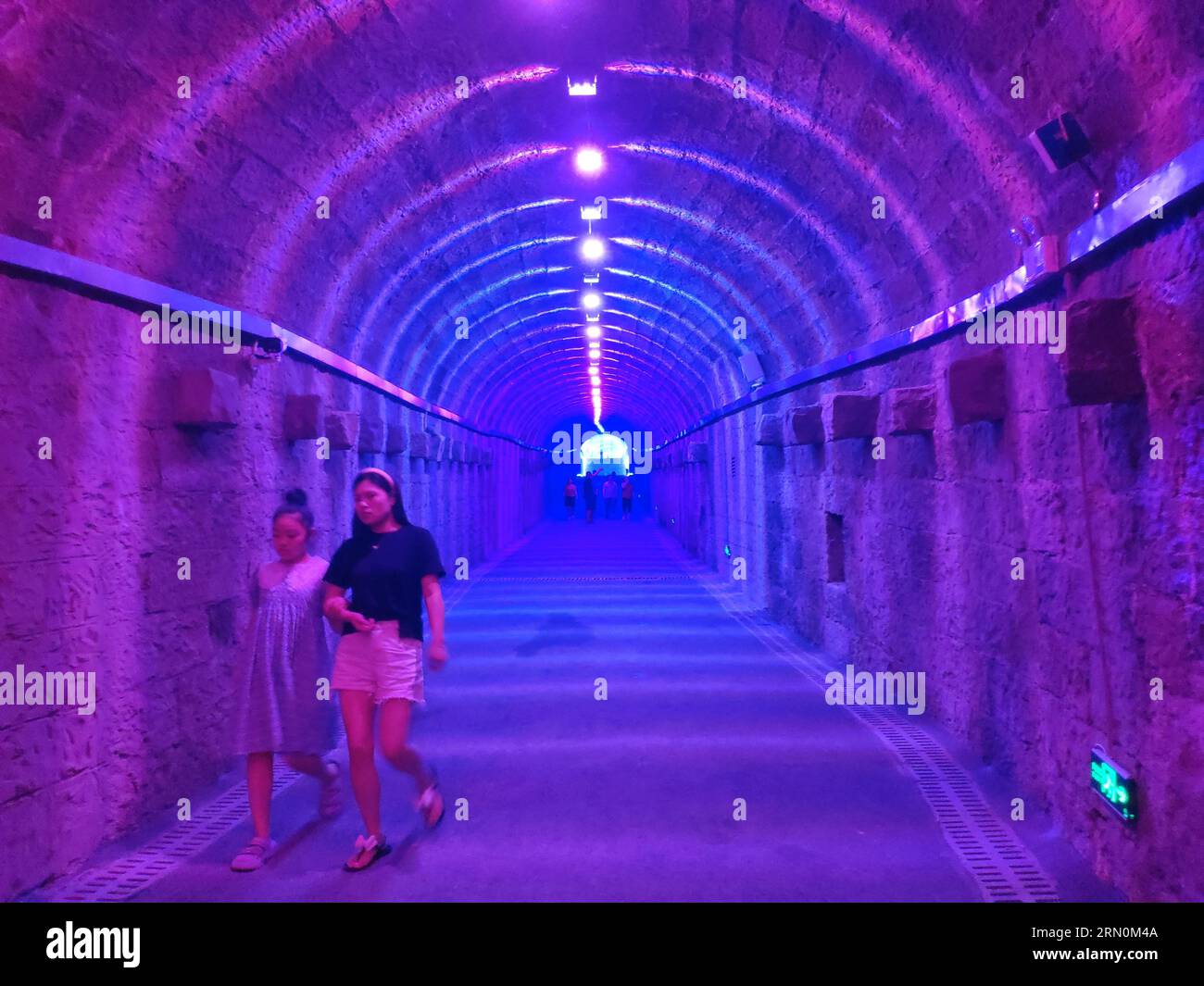 People stroll at a transformed air-raid shelter in Chongqing, China ...