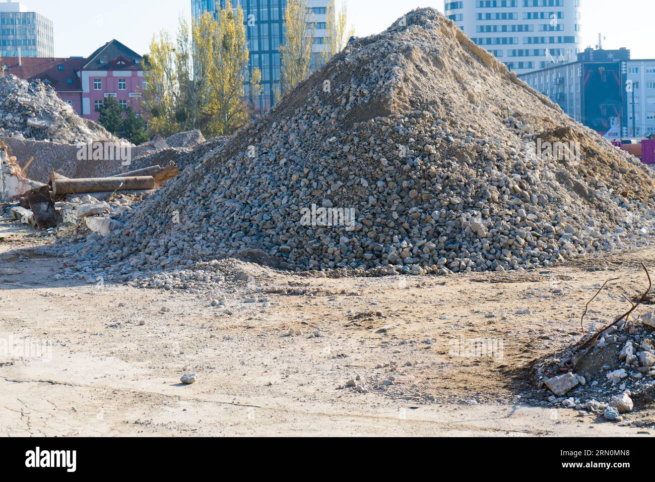 Large hills and piles of sand, gravel, crushed stone of a white, gray ...