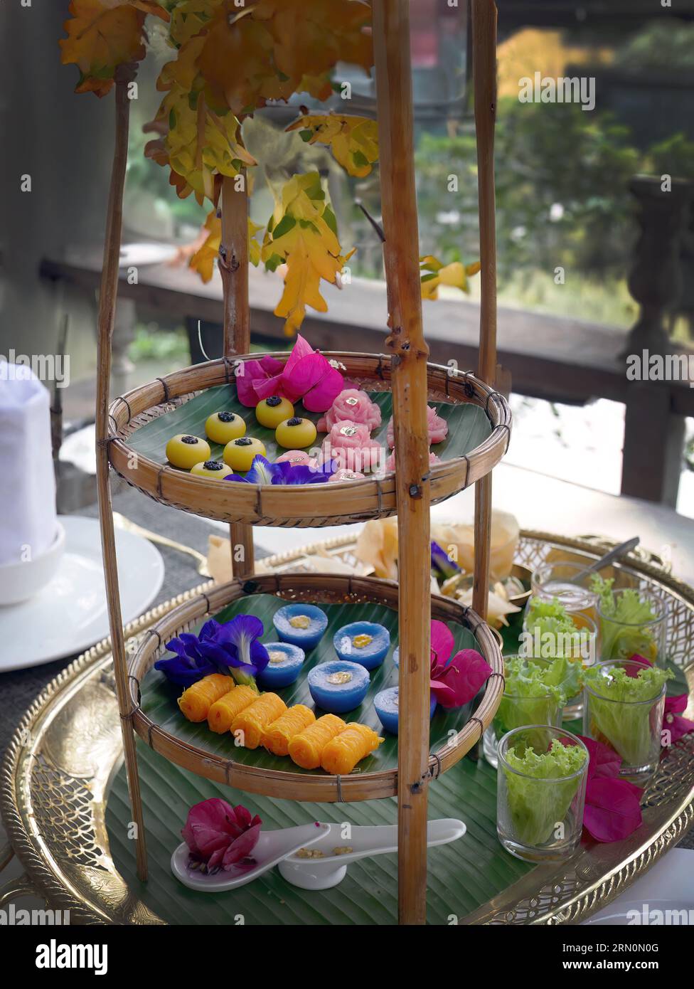 Various kind and color of Thai sweet dessert snack on banana leaf in ...