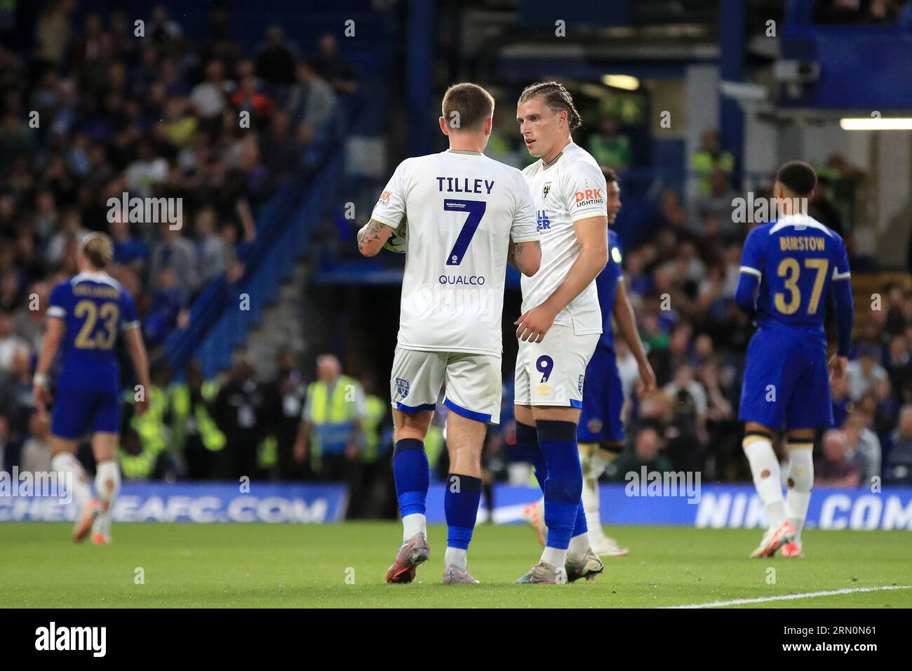 London, UK. 30th Aug, 2023. James Tilley of AFC Wimbledon and Josh ...