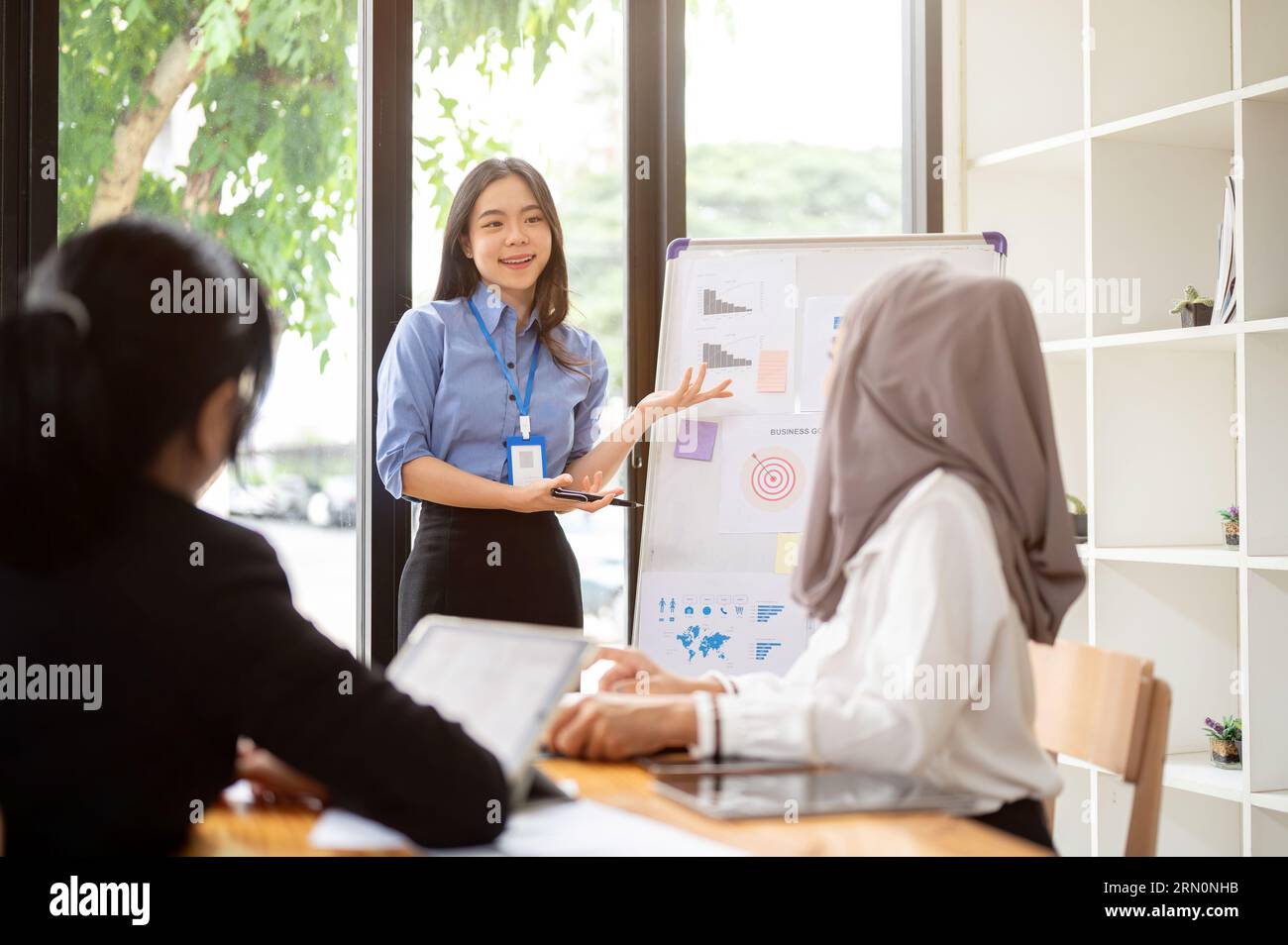 A pretty and charming young Asian businesswoman or female financial ...