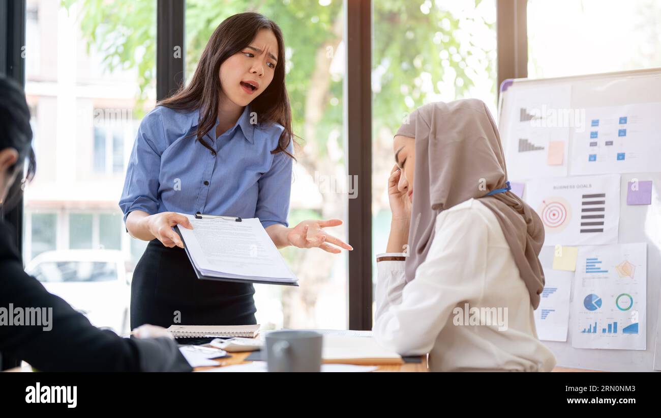 Serious female employee dissatisfied hi-res stock photography and ...