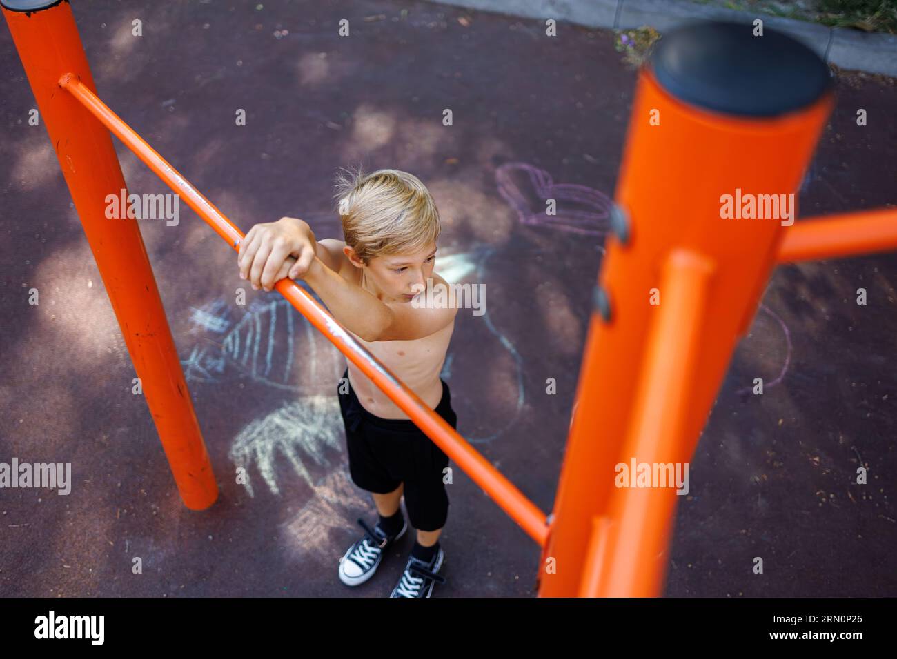 Top view of a sporty teenager boy who is standing in front of a ...