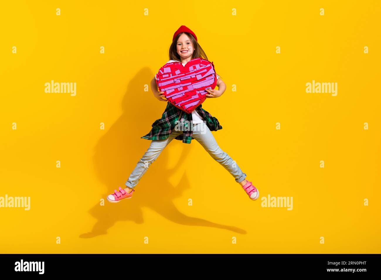 Full size photo of adorable schoolgirl jump spread legs hold heart ...
