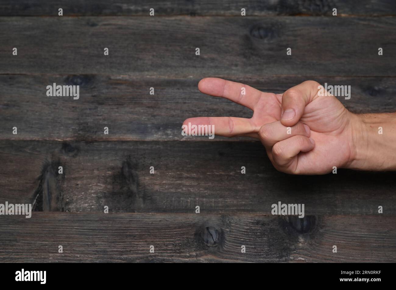 male hand showing fingers making victory sign. number two. gesture of ...