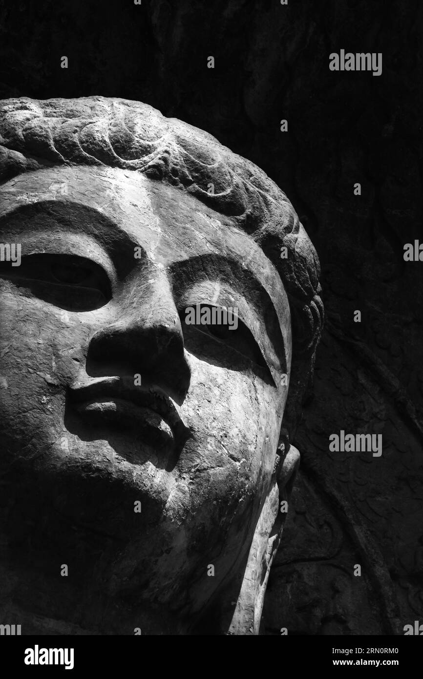 A close-up shot of The statue of Buddha from the Tang Dynasty of China ...