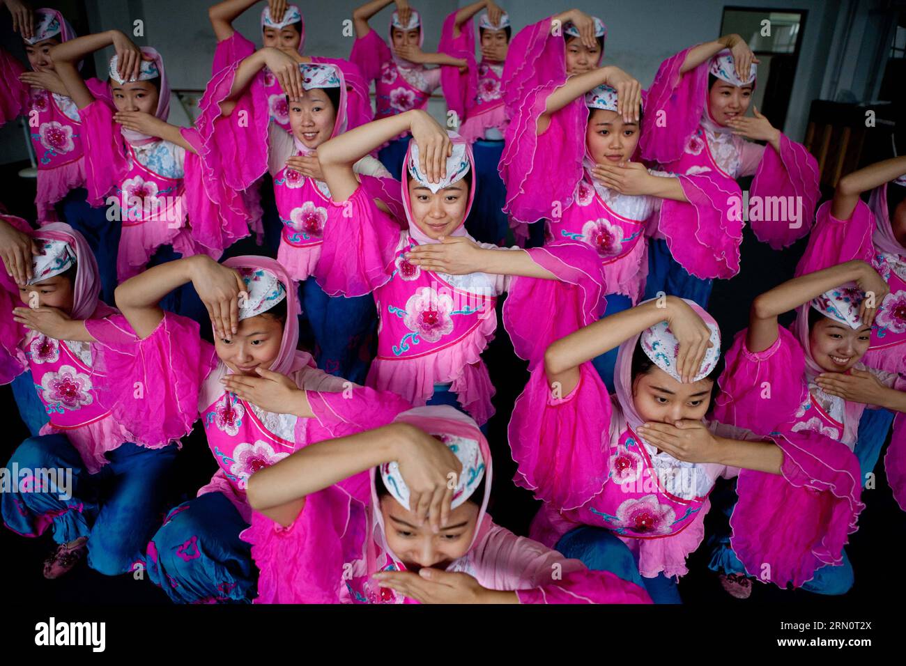 Photo taken on Oct. 31, 2014 shows girls practicing a traditional dance ...