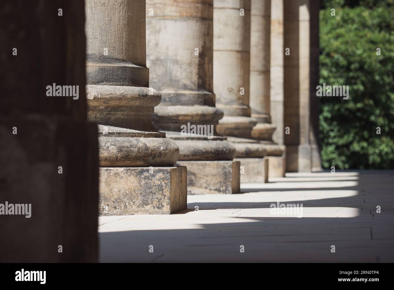 detail of light and shadow on a stylobate of a column or pillar in a ...