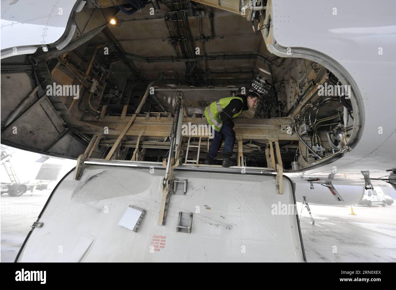 Photo taken on Nov. 20, 2014 shows ground crew checks landing gear ...