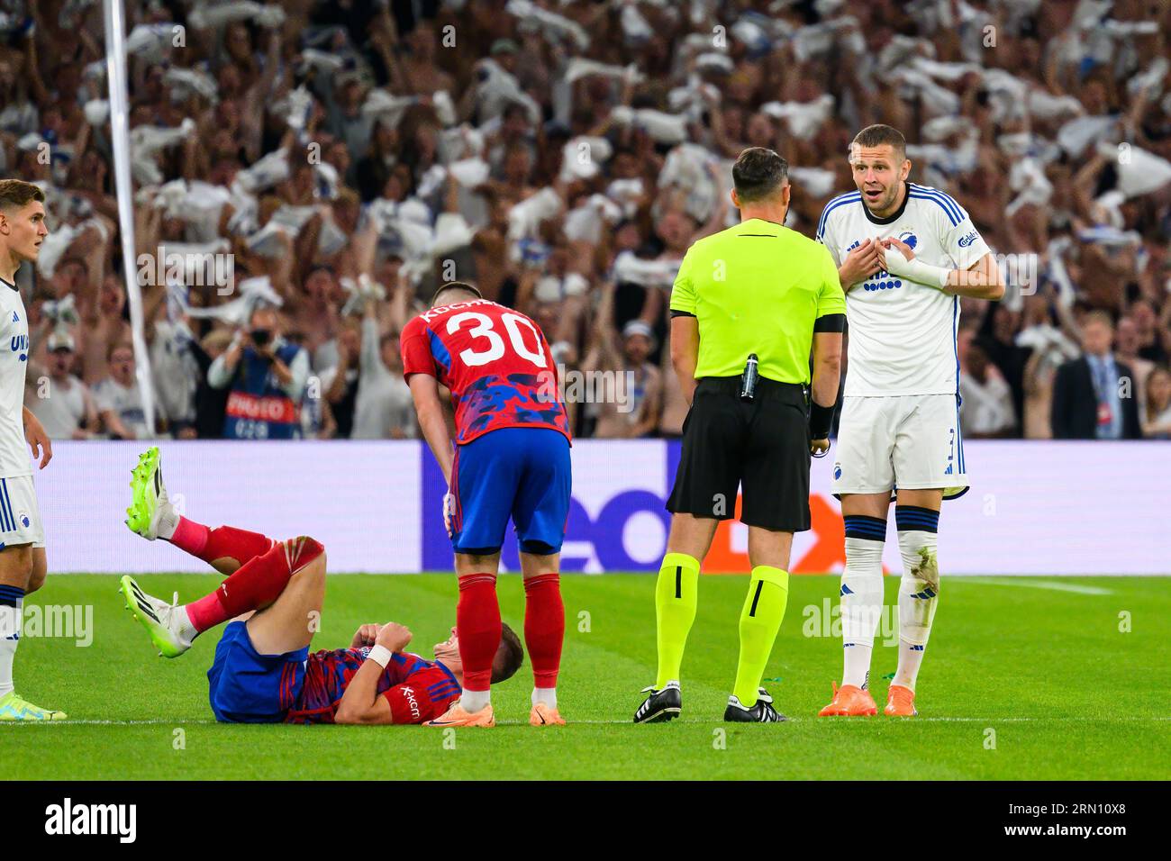 Copenhagen, Denmark. 30th Aug, 2023. Referee Istvan Kovacs is having a word with Denis Vavro (3 ...