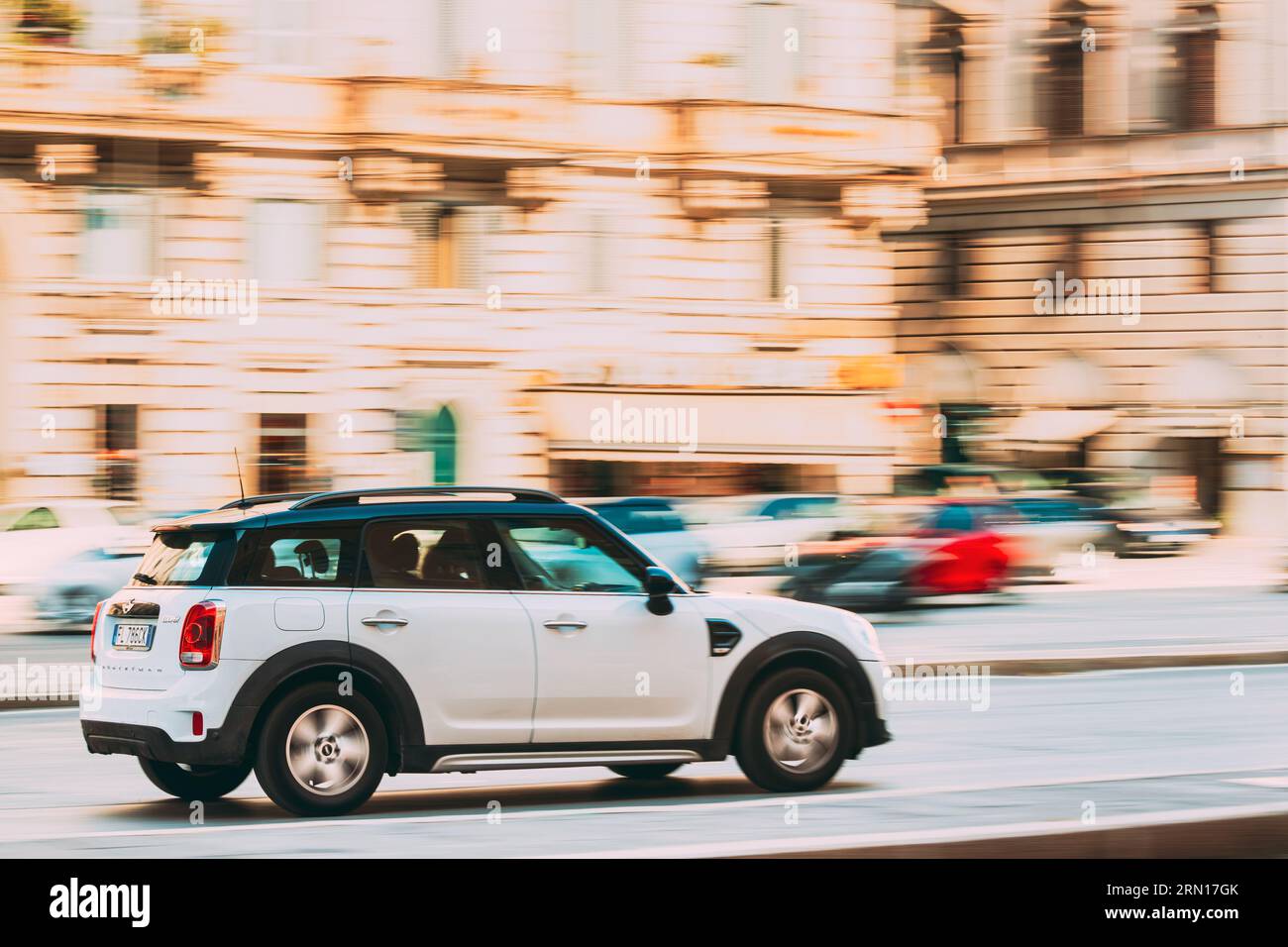 White Color Car Mini Cooper Mini Countryman Fast Moving At City Street ...