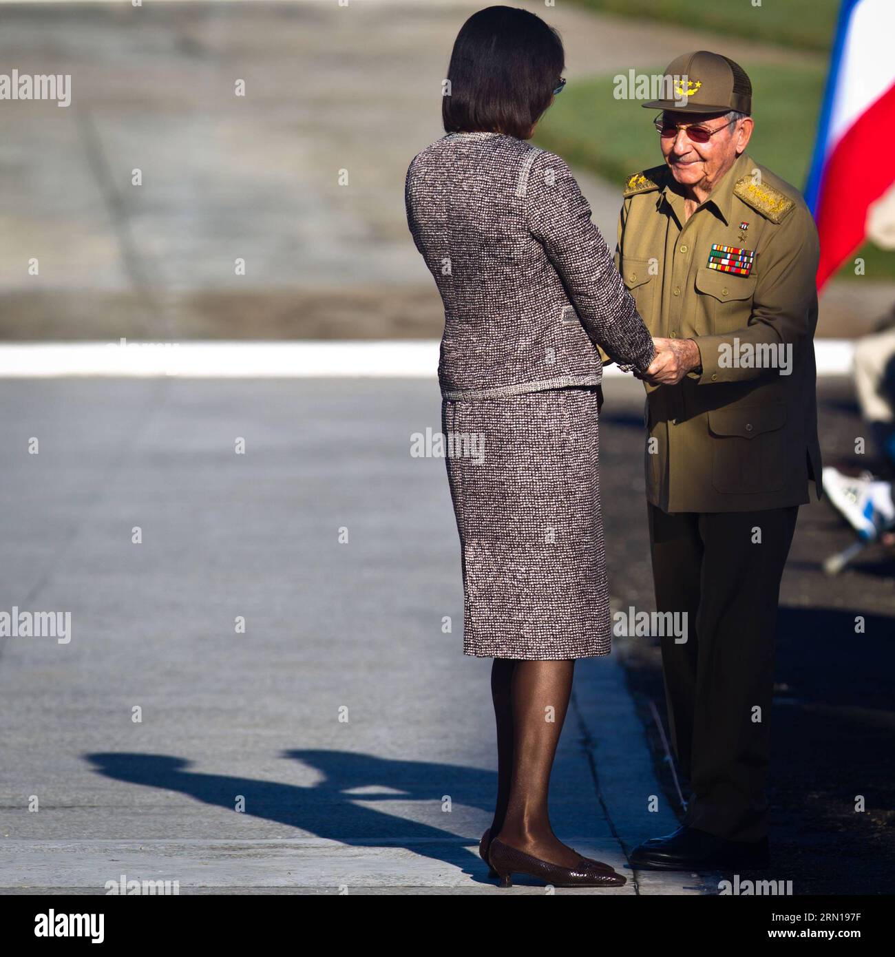 Cuban President Raul Castro (R) shakes hands with Jamaican Prime ...
