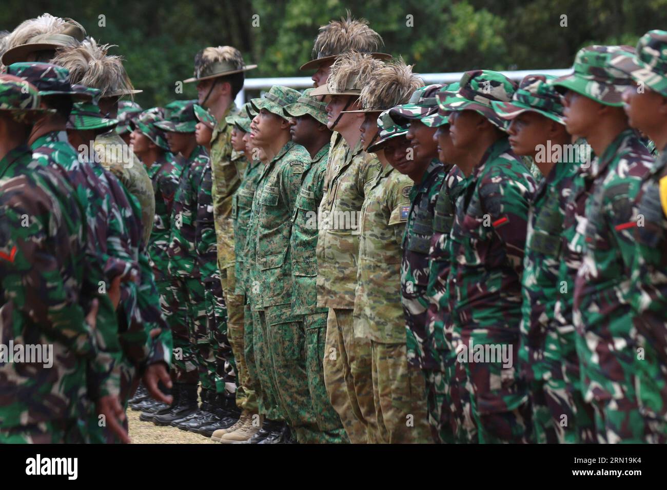 Indonesian, Singaporean and Australian Army soldiers attend the opening ...