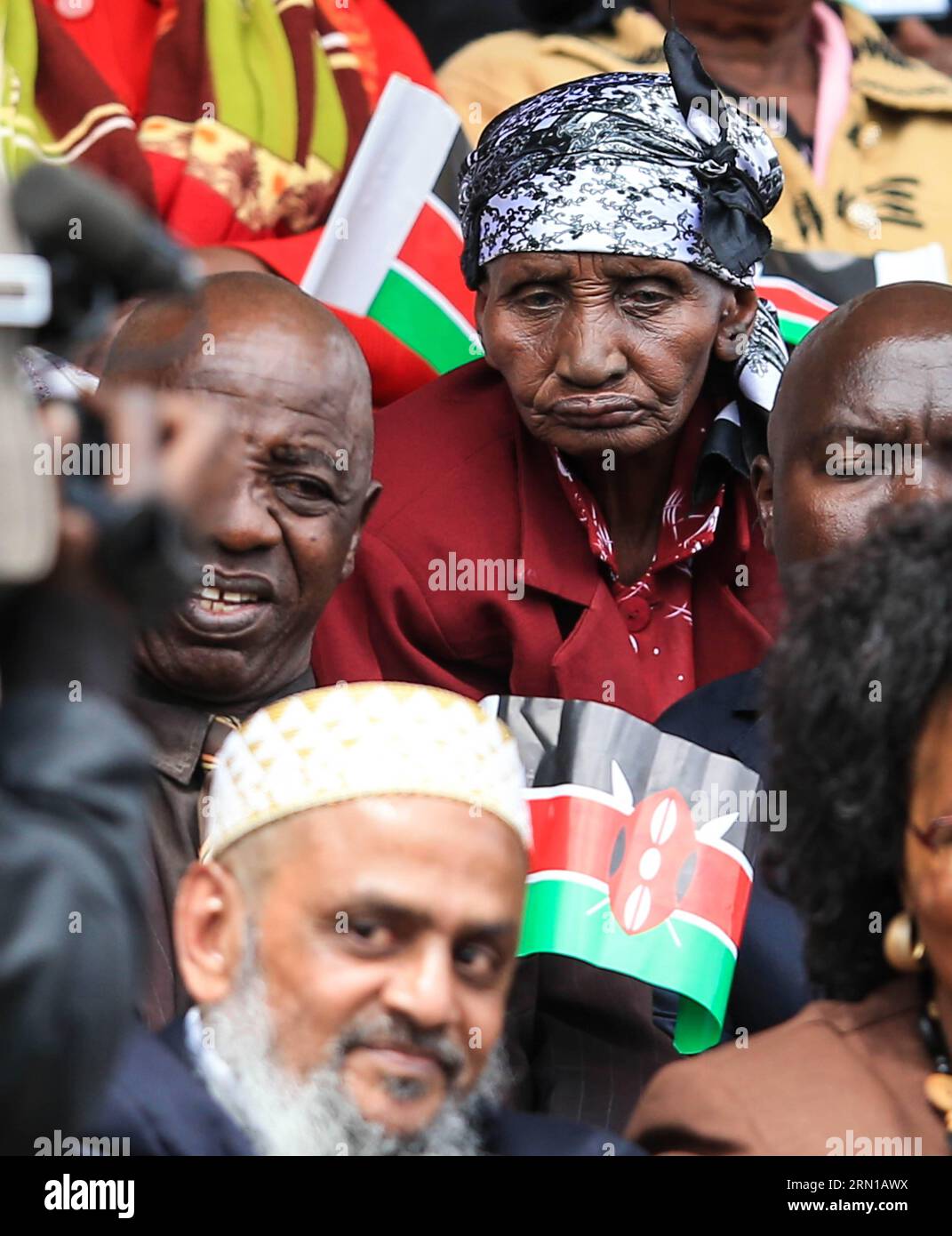 (141212) -- NAIROBI, Dec. 12, 2014 -- An aged woman attends the 51th ...