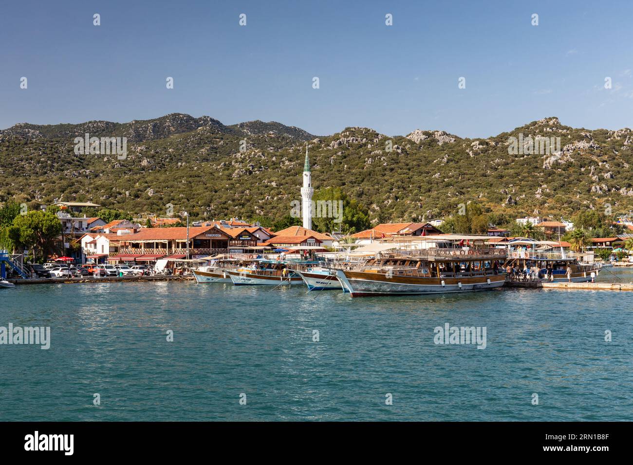 Tourist excursion boats moored in Simena village harbour, Simena ...