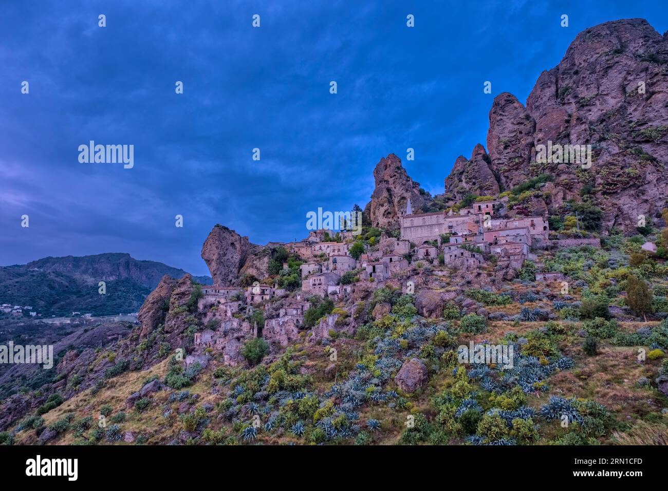 The village of Pentedattilo, damaged by an earthquake in 1783 and a ...