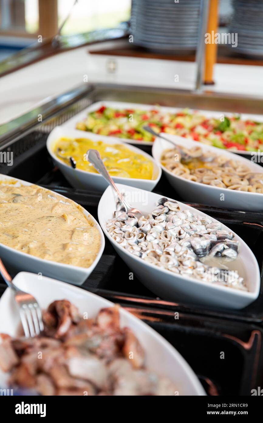 Variety fish dishes served buffet lunch. Healthy seafood dinner ...