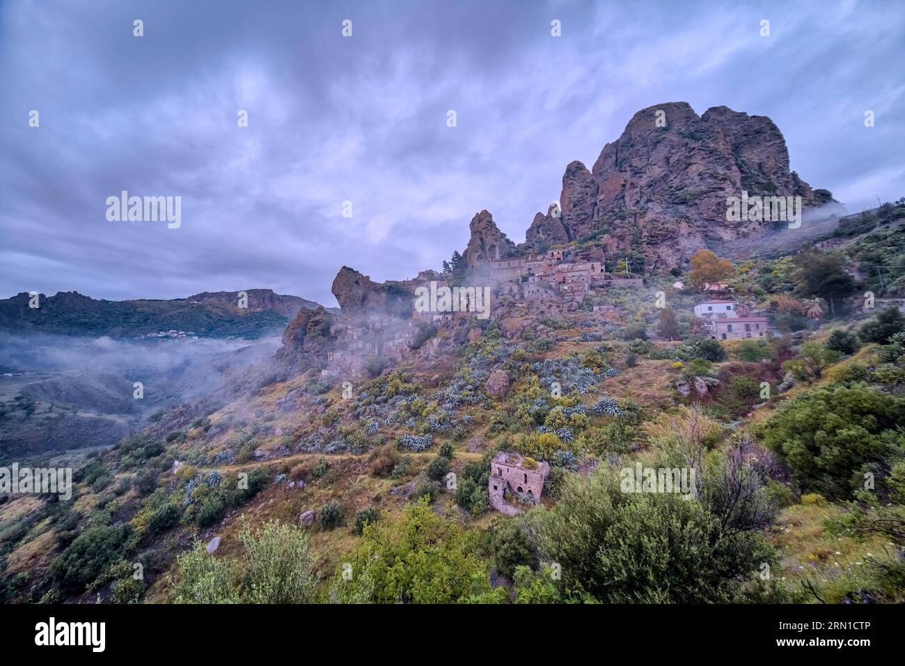 The village of Pentedattilo, damaged by an earthquake in 1784 and a ...