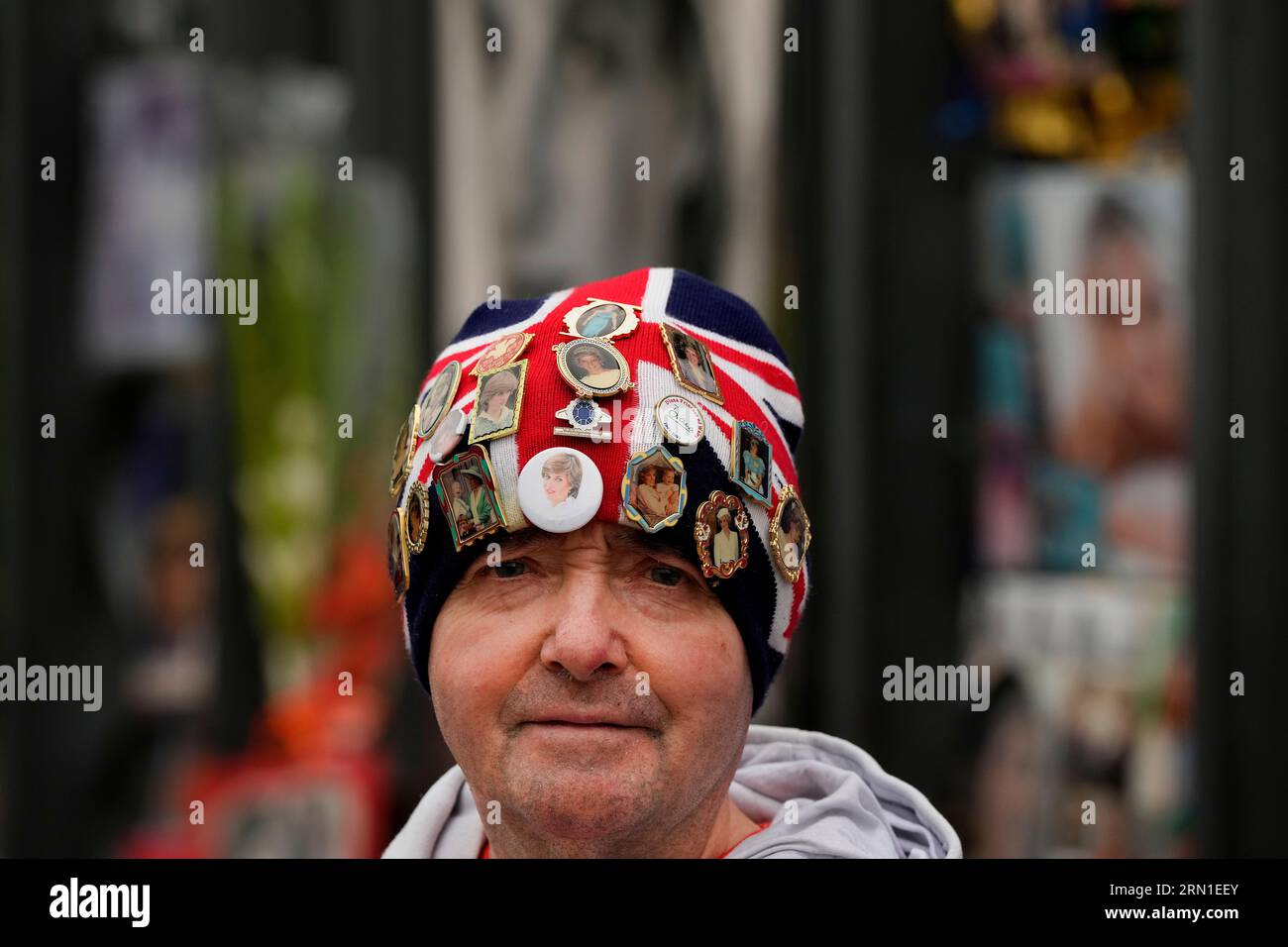 Royal fan John Loughrey stands in front of pictures of Princess Diana ...