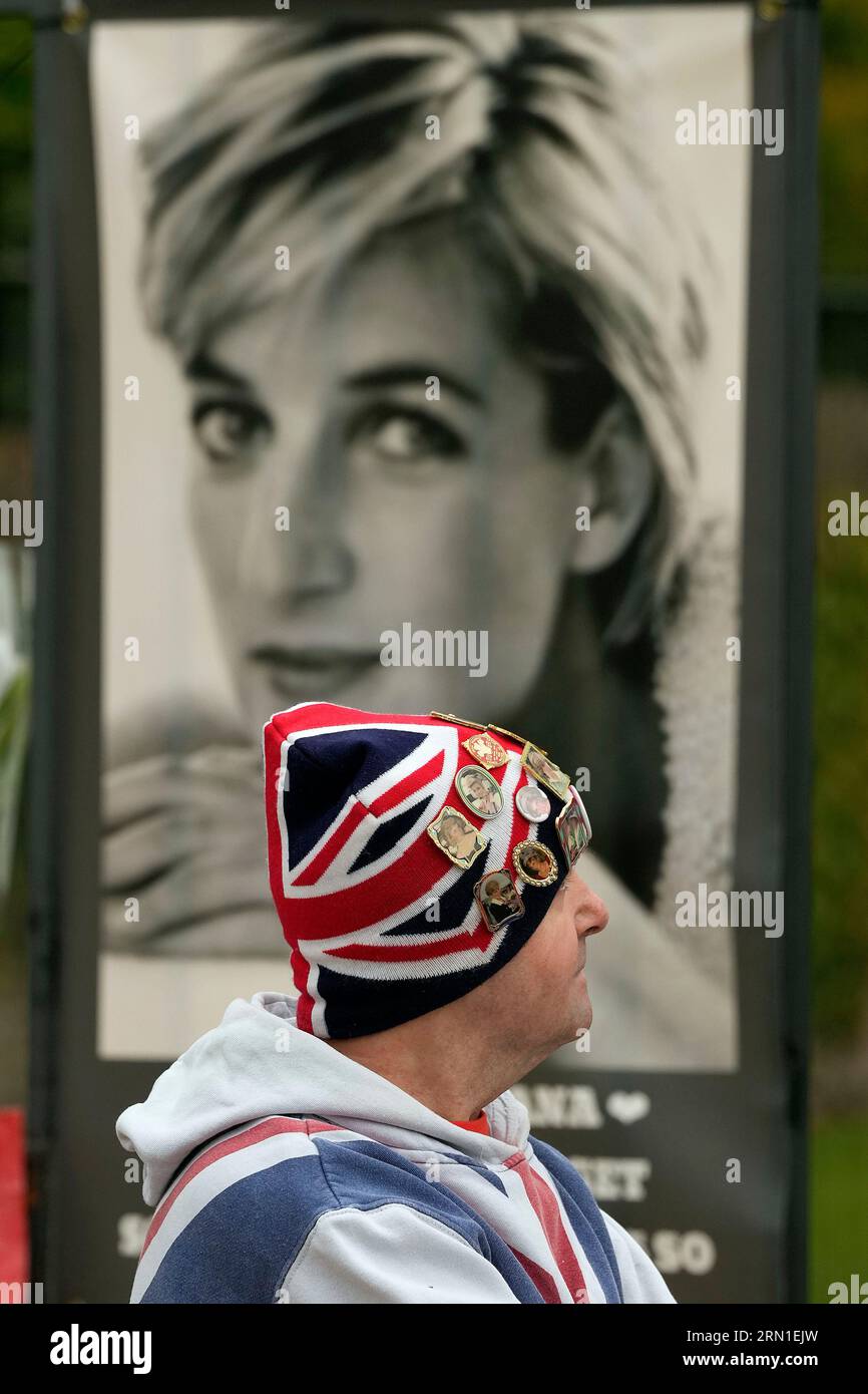 Royal fan John Loughrey stands in front of pictures of Princess Diana ...