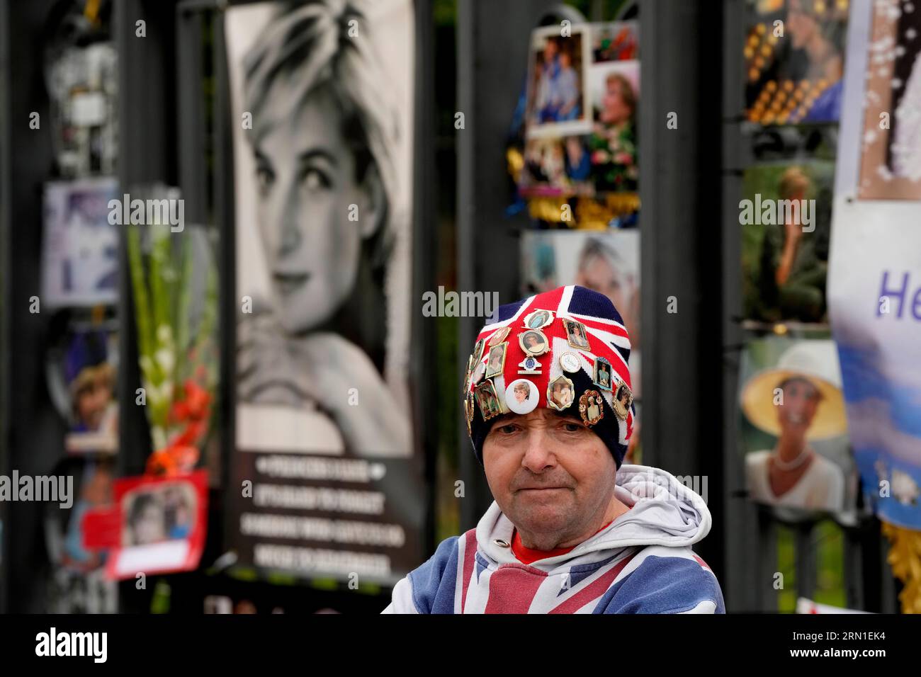 Royal fan John Loughrey stands in front of pictures of Princess Diana ...