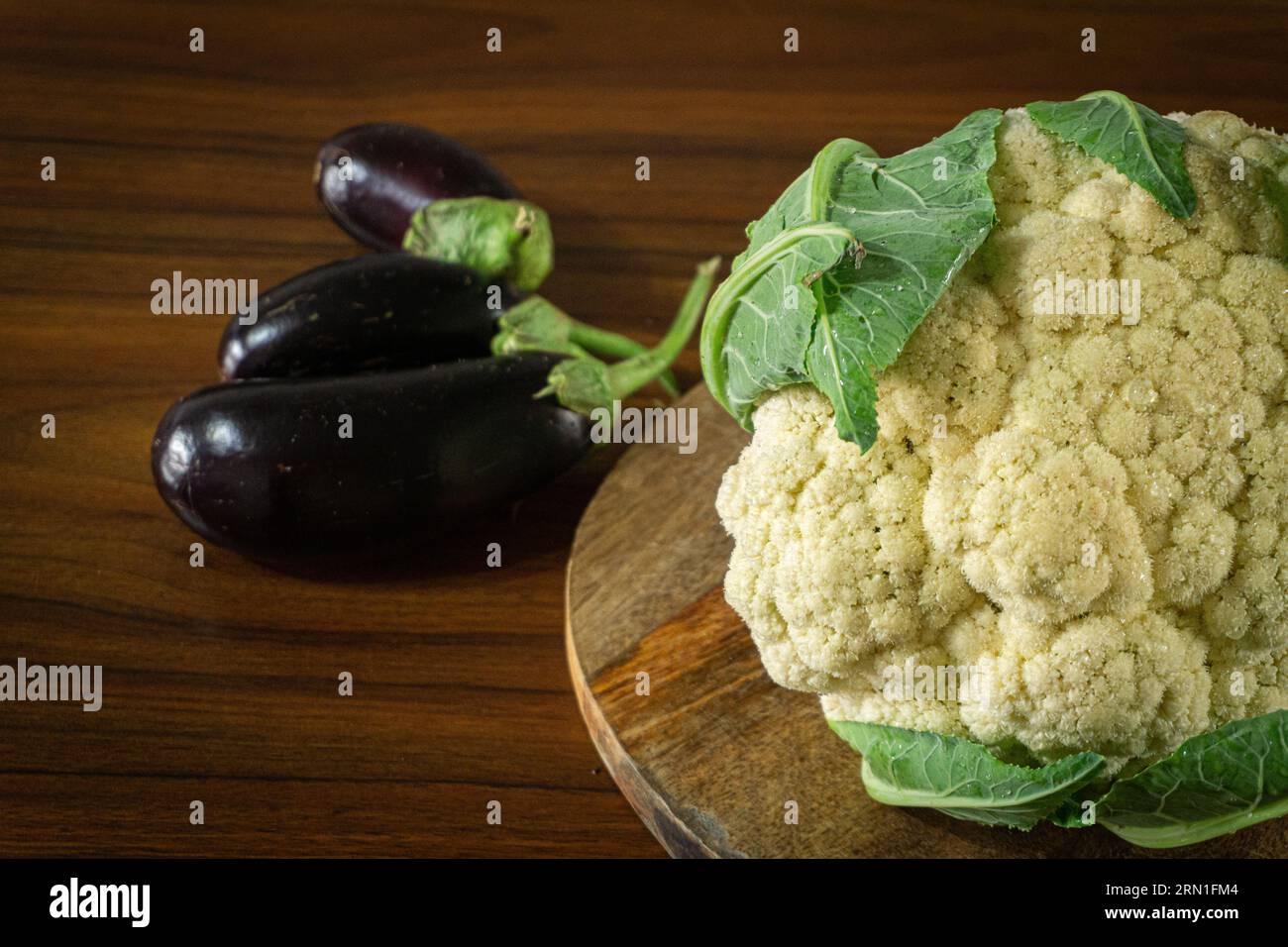 Whole head of the fresh raw cauliflower with some leaves Stock Photo ...