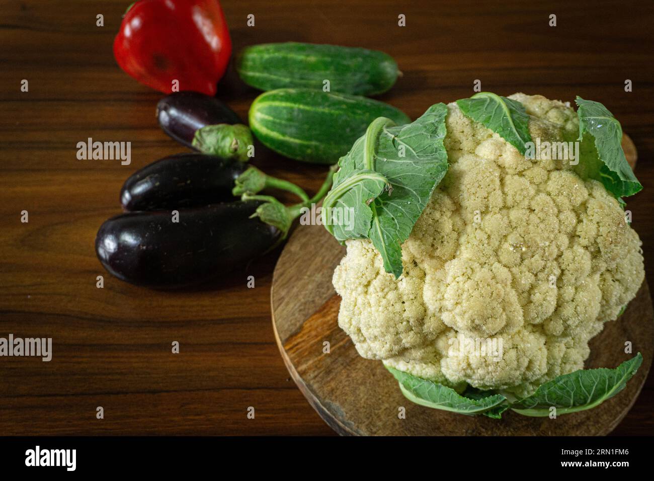 Whole head of the fresh raw cauliflower with some leaves Stock Photo ...