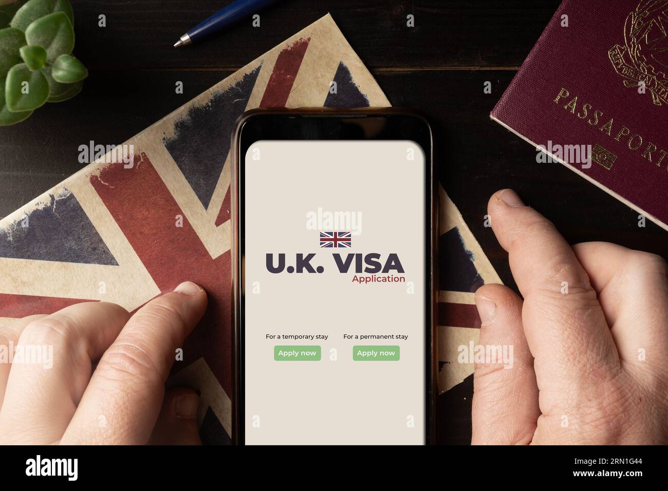 UK visa application concept: man fill a Uk visa application form on his ...
